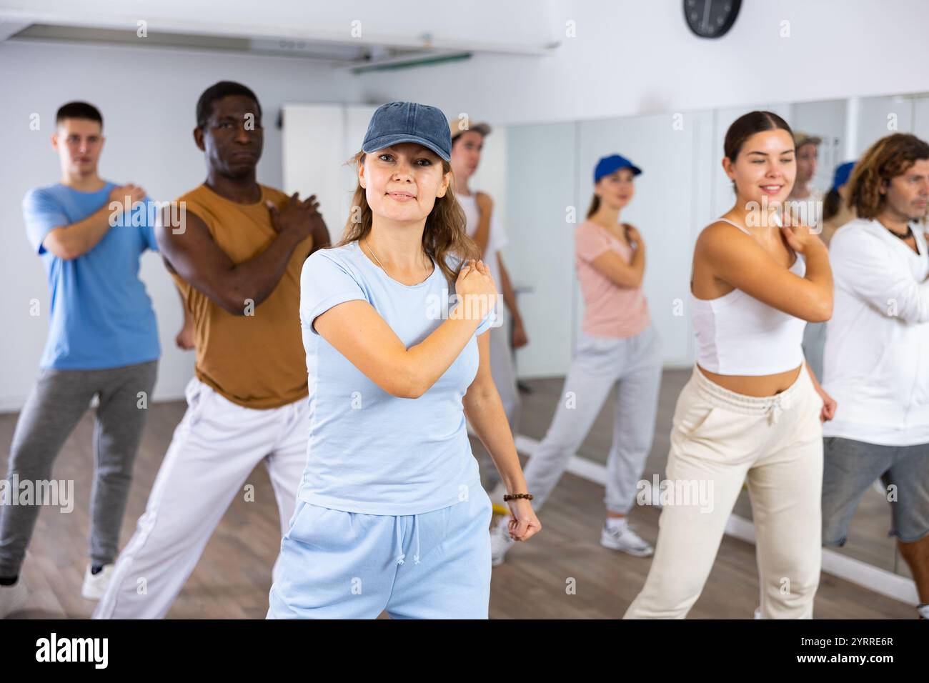 Group dancers performing dynamic movements hi-res stock photography and ...