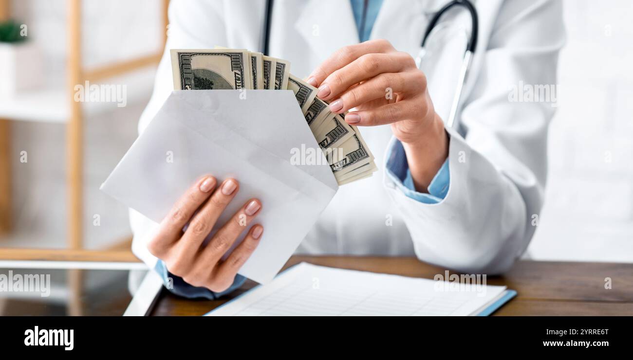 Expensive medicine. Smiling doctor counts money in envelope Stock Photo ...