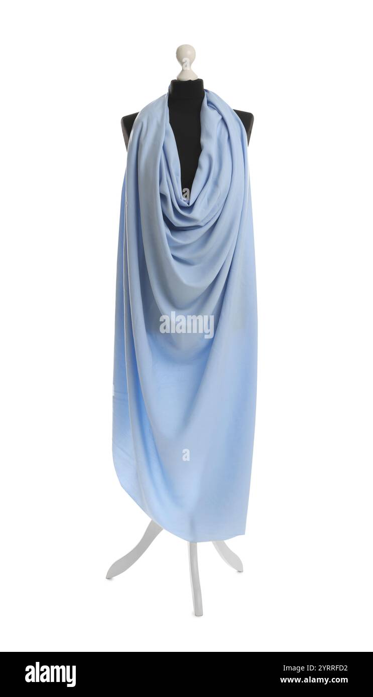 Draping light blue fabric on female mannequin against white background ...