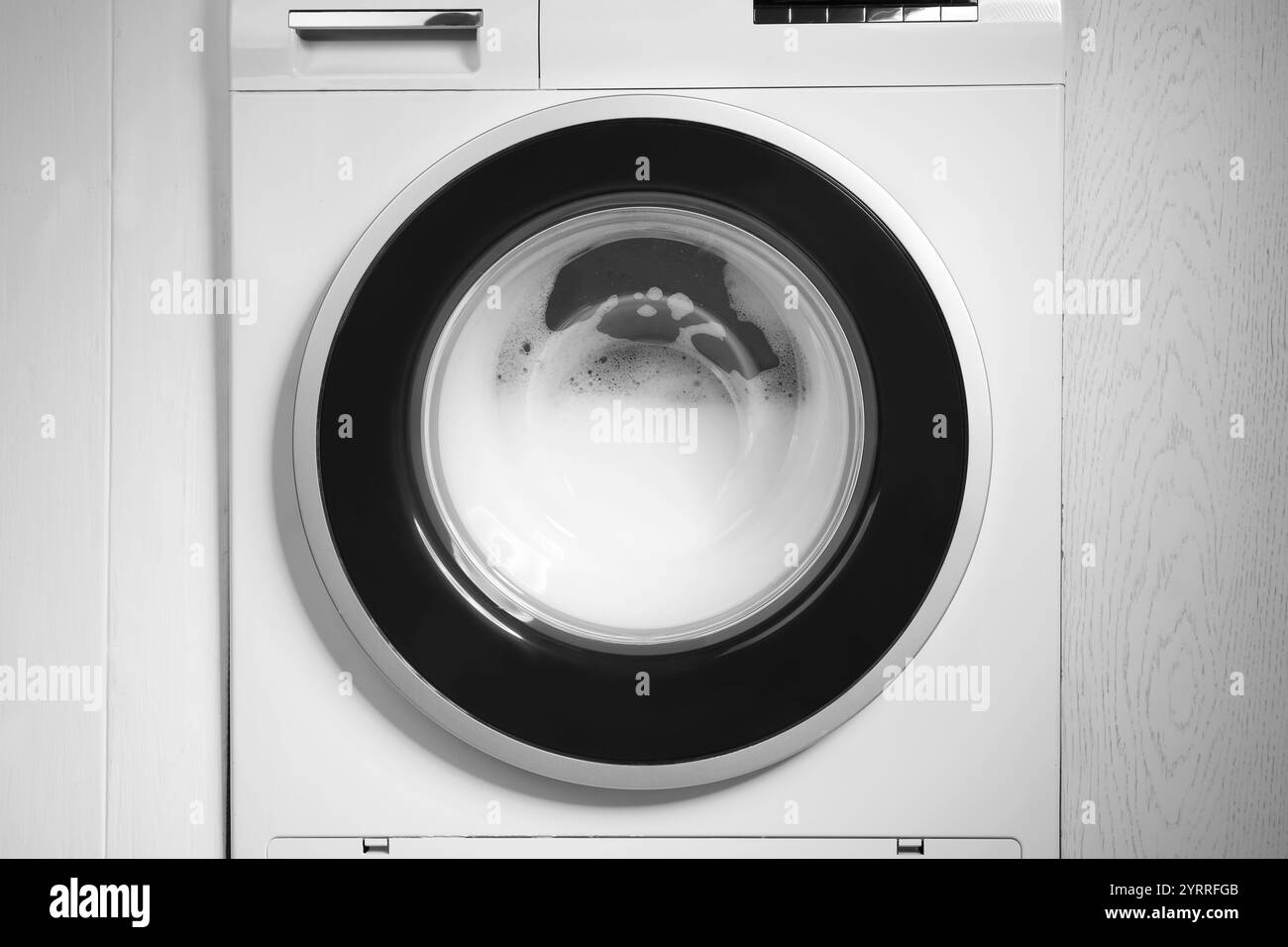 Washing machine with suds as background, closeup Stock Photo - Alamy
