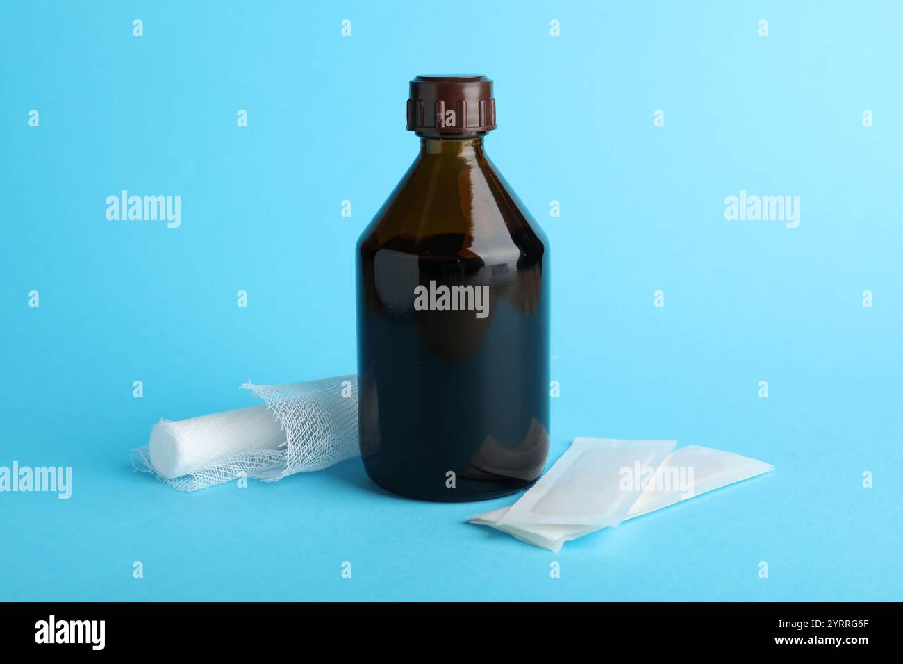 Topical iodine and bandages on light blue background Stock Photo - Alamy