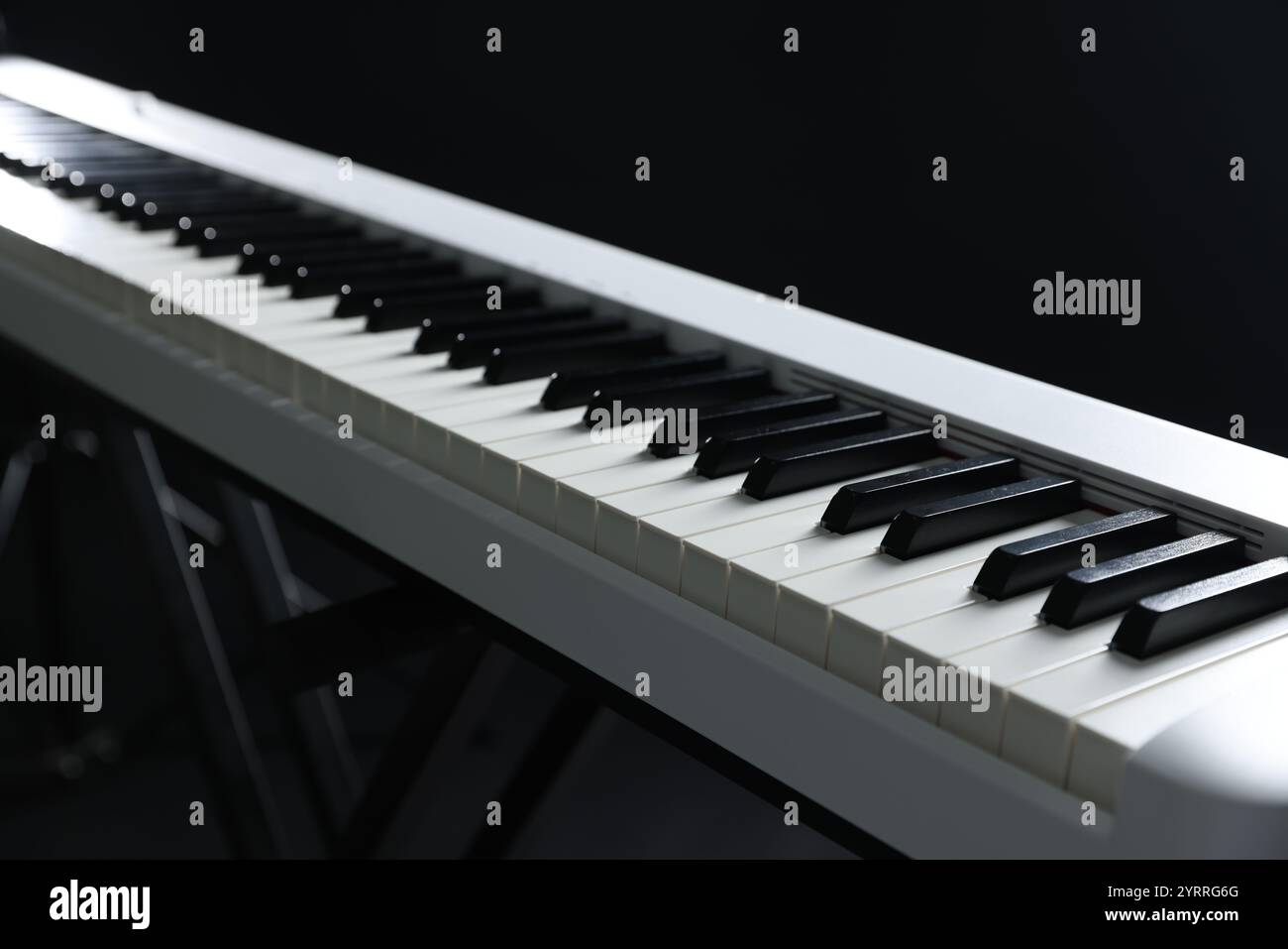 Synthesizer on black background, closeup. Electronic musical instrument ...