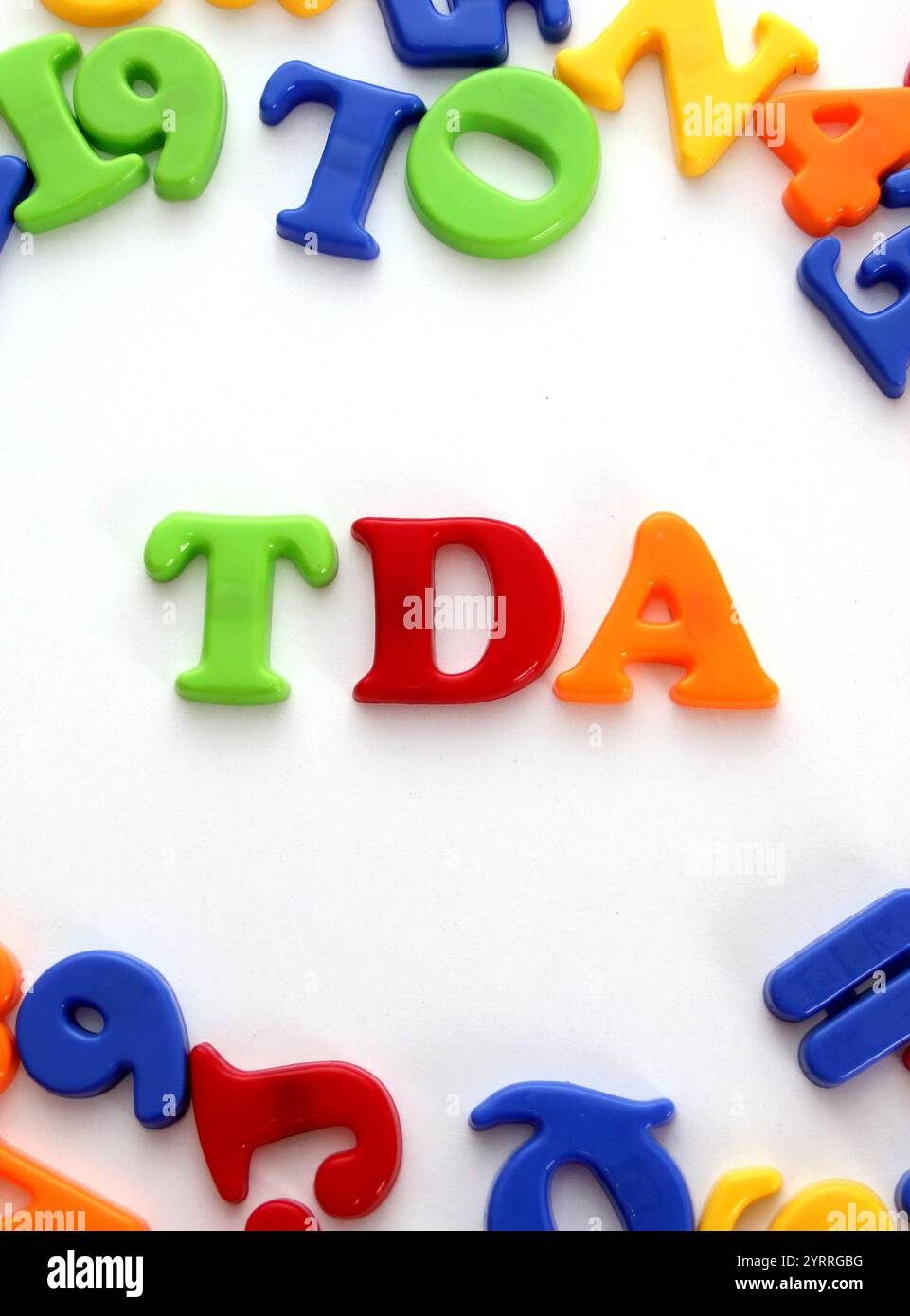 Colored toy letters for children form the word TDAH which means ...