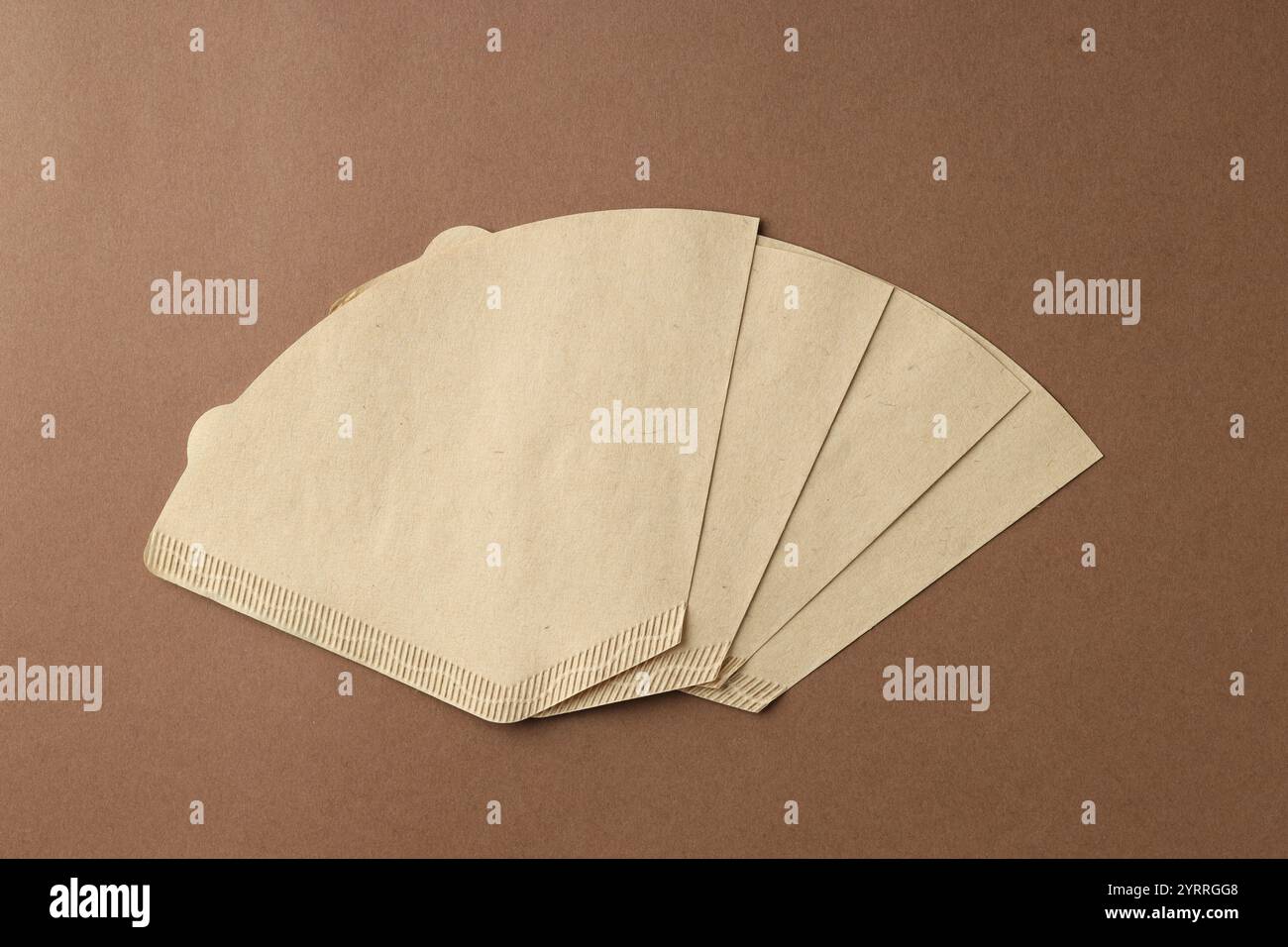 Paper coffee filters on brown background, flat lay Stock Photo - Alamy