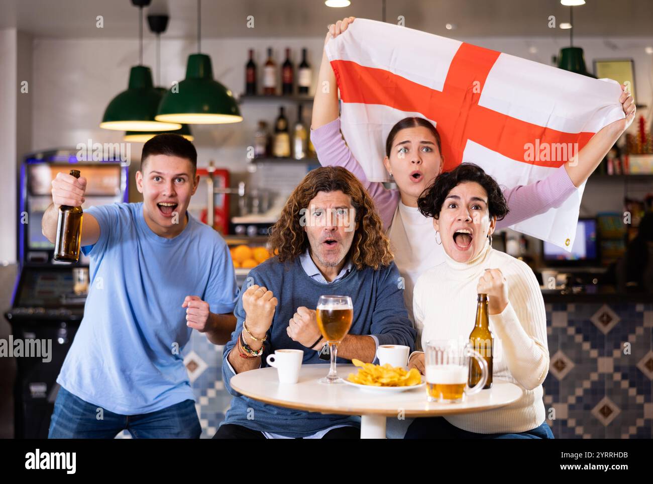 Group of people with England flag toasting with beer, having fun at ...