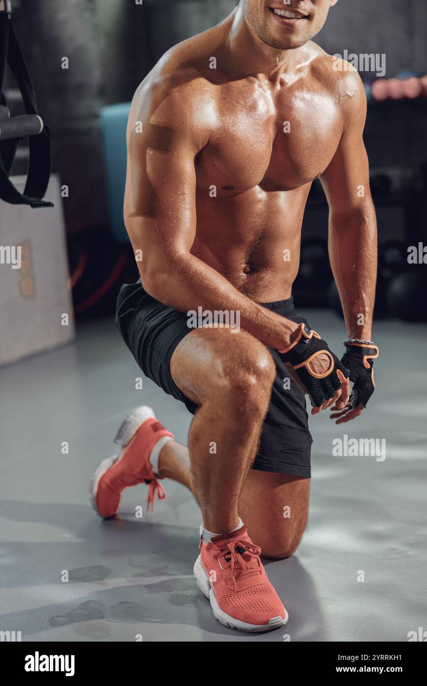 A Fit Young Man Focused on Engaging in a Rigorous Workout Session at a ...