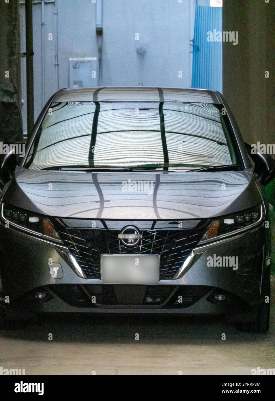 Nissan Note car parked in a garage in Asakusa Tokyo Japan Stock Photo ...