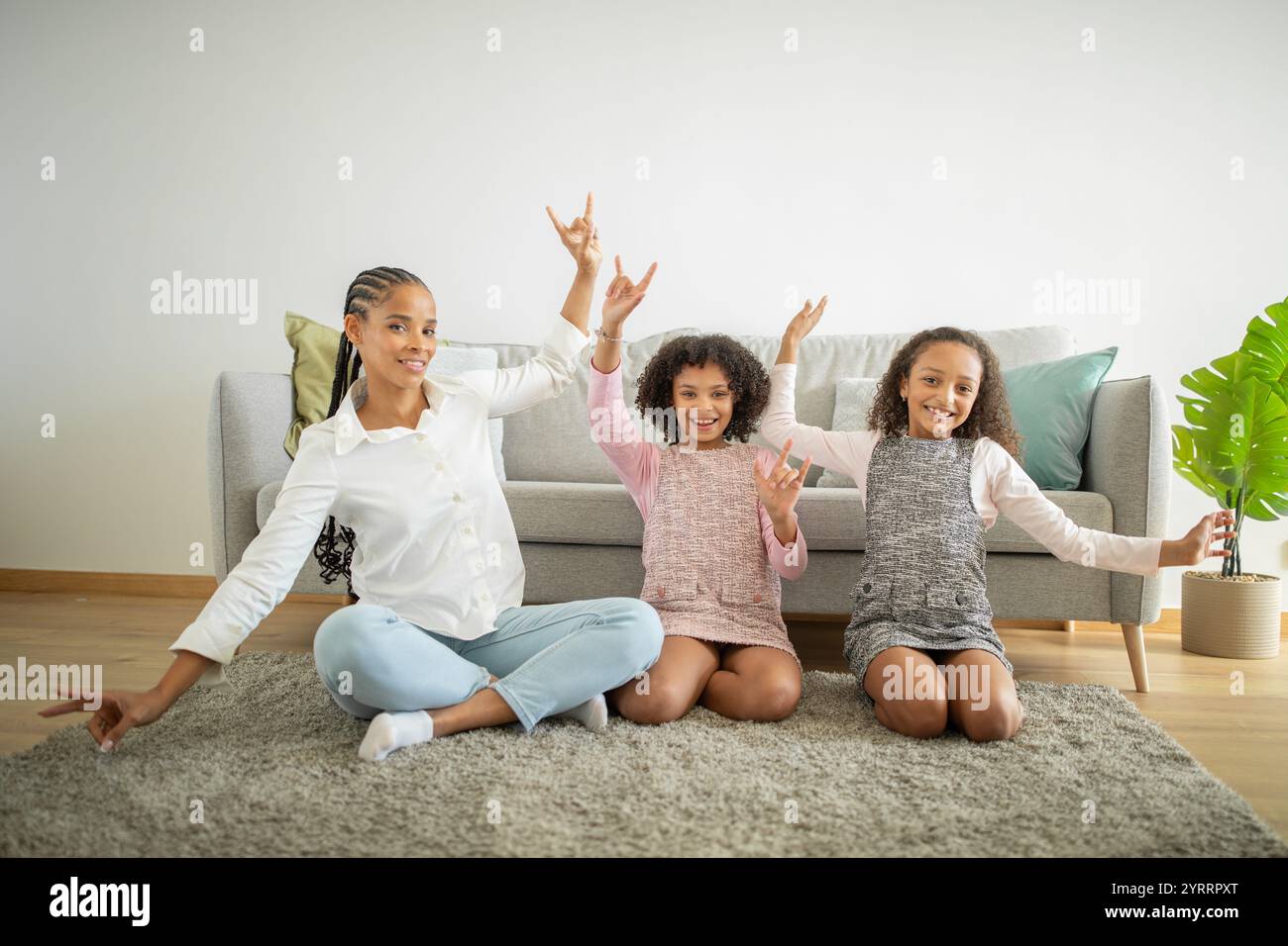 Family bonding time with kids in a cozy home setting Stock Photo - Alamy