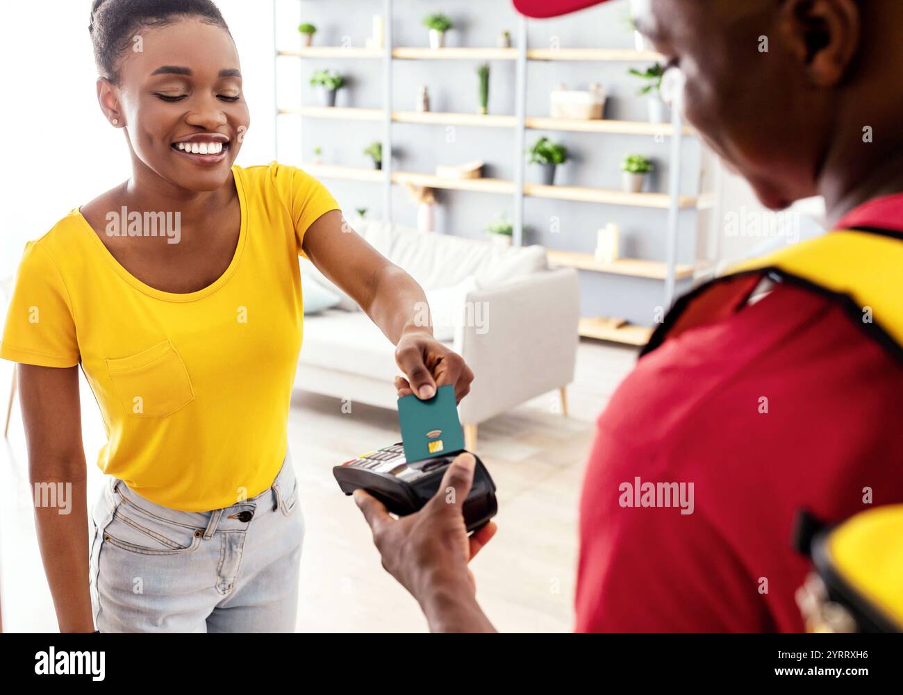 Black Female Paying With Credit Card For Delivery At Home Stock Photo ...
