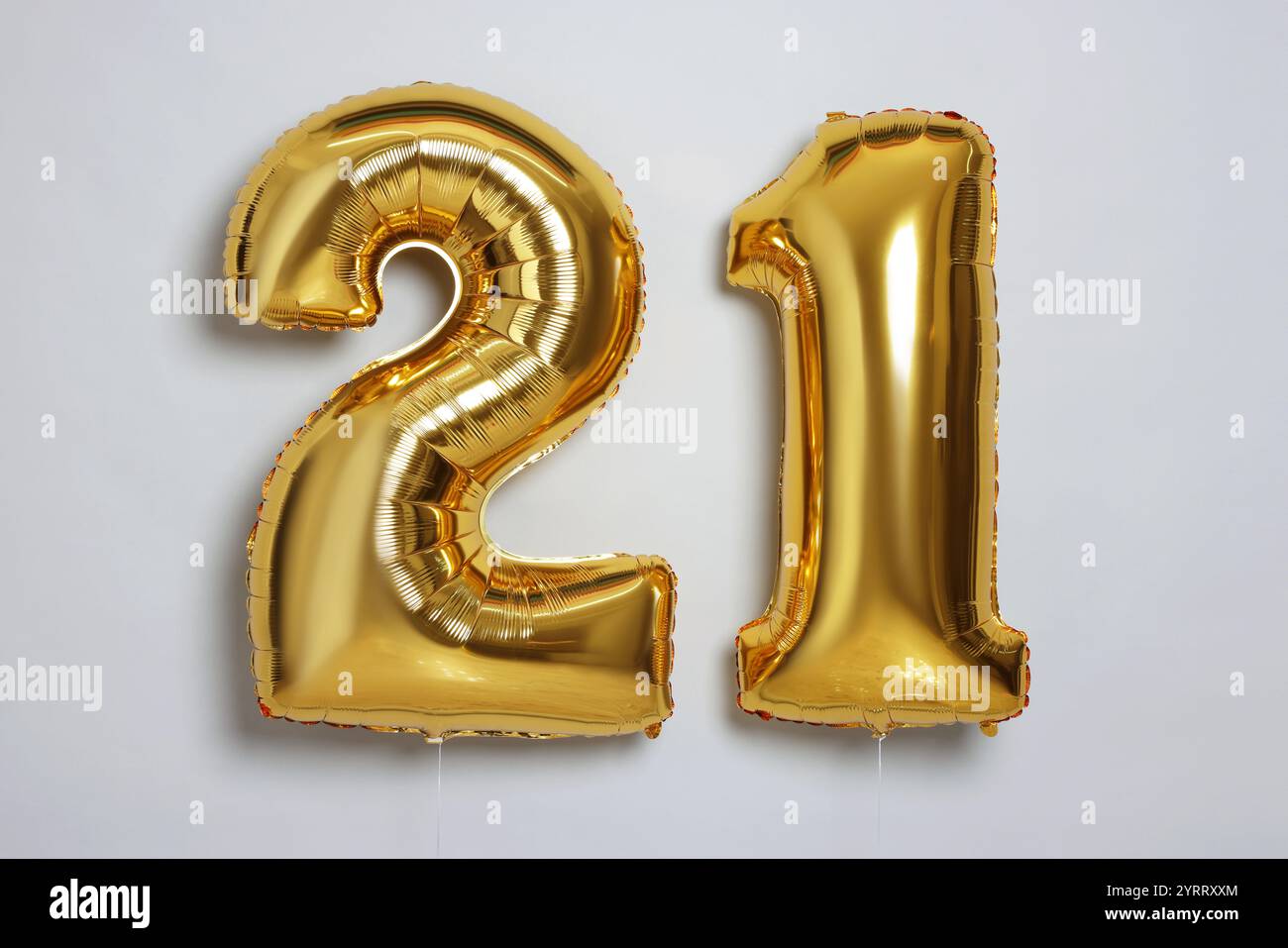 Coming of age party - 21st birthday. Number shaped balloons on light ...