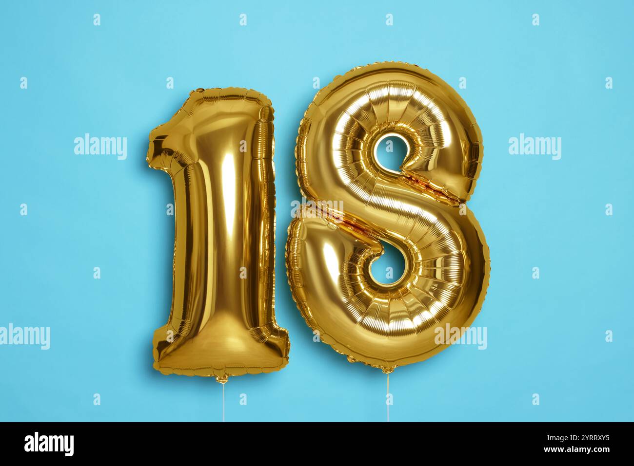 Coming of age party - 18th birthday. Number shaped balloons on light ...