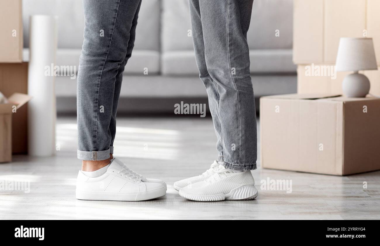 Legs of hugging couple moving to new house Stock Photo - Alamy