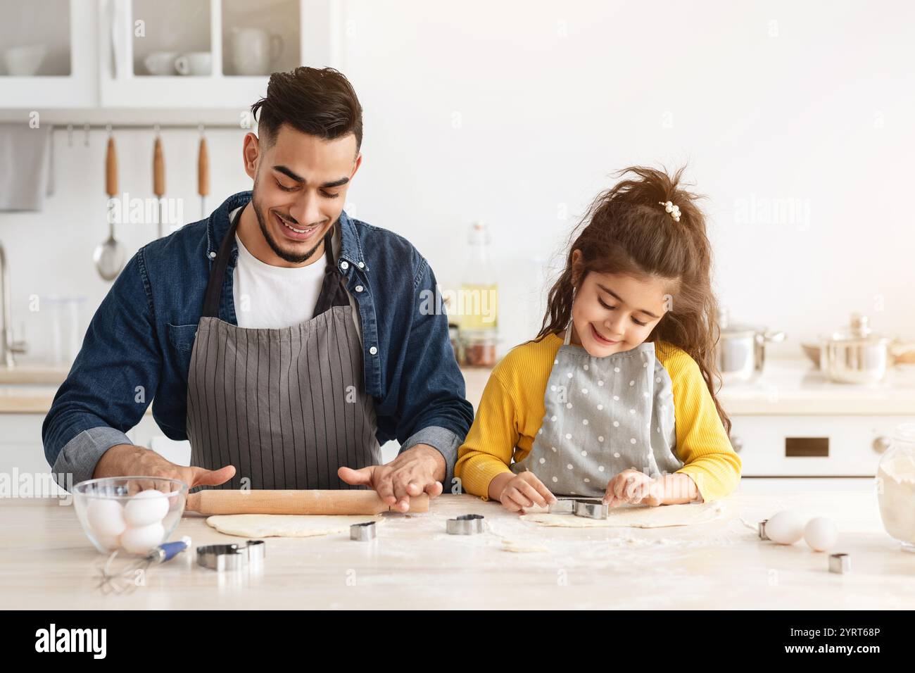 Positive Arab Family Dad And Daughter Baking Cookies In Kitchen ...
