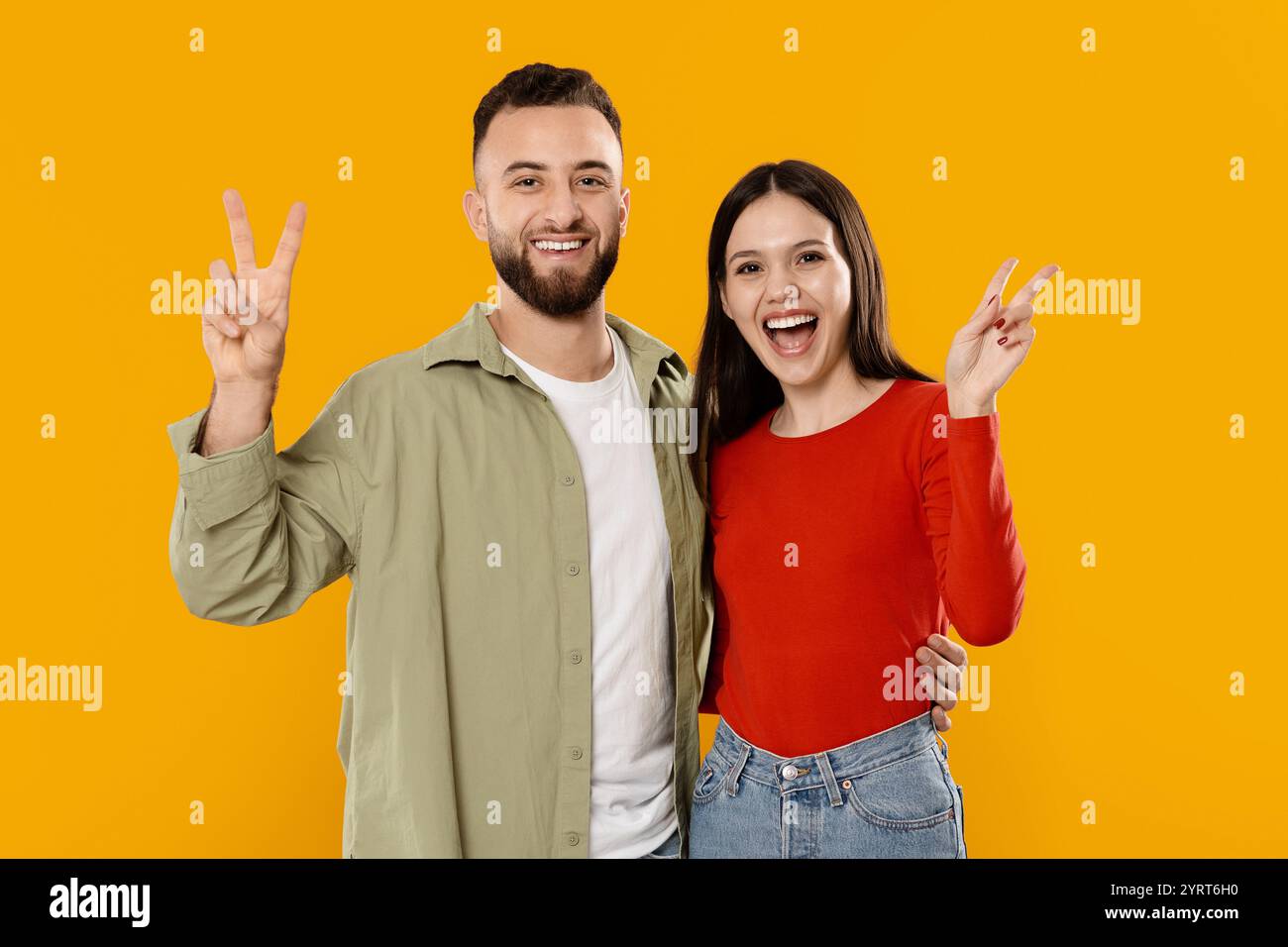Woman posing peace signs hi-res stock photography and images - Alamy