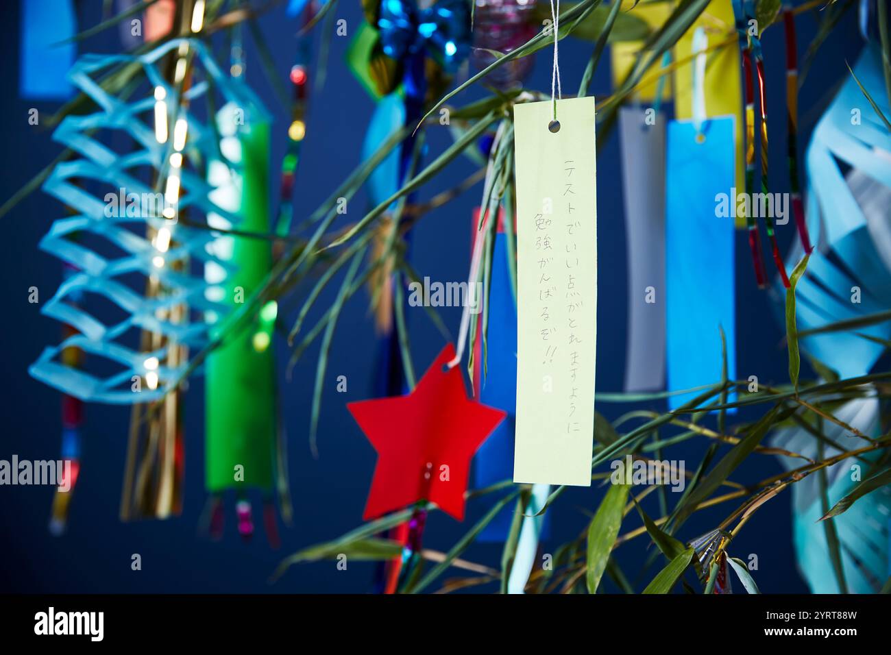 Tanabata decorations and strips of paper with wishes written on them ...