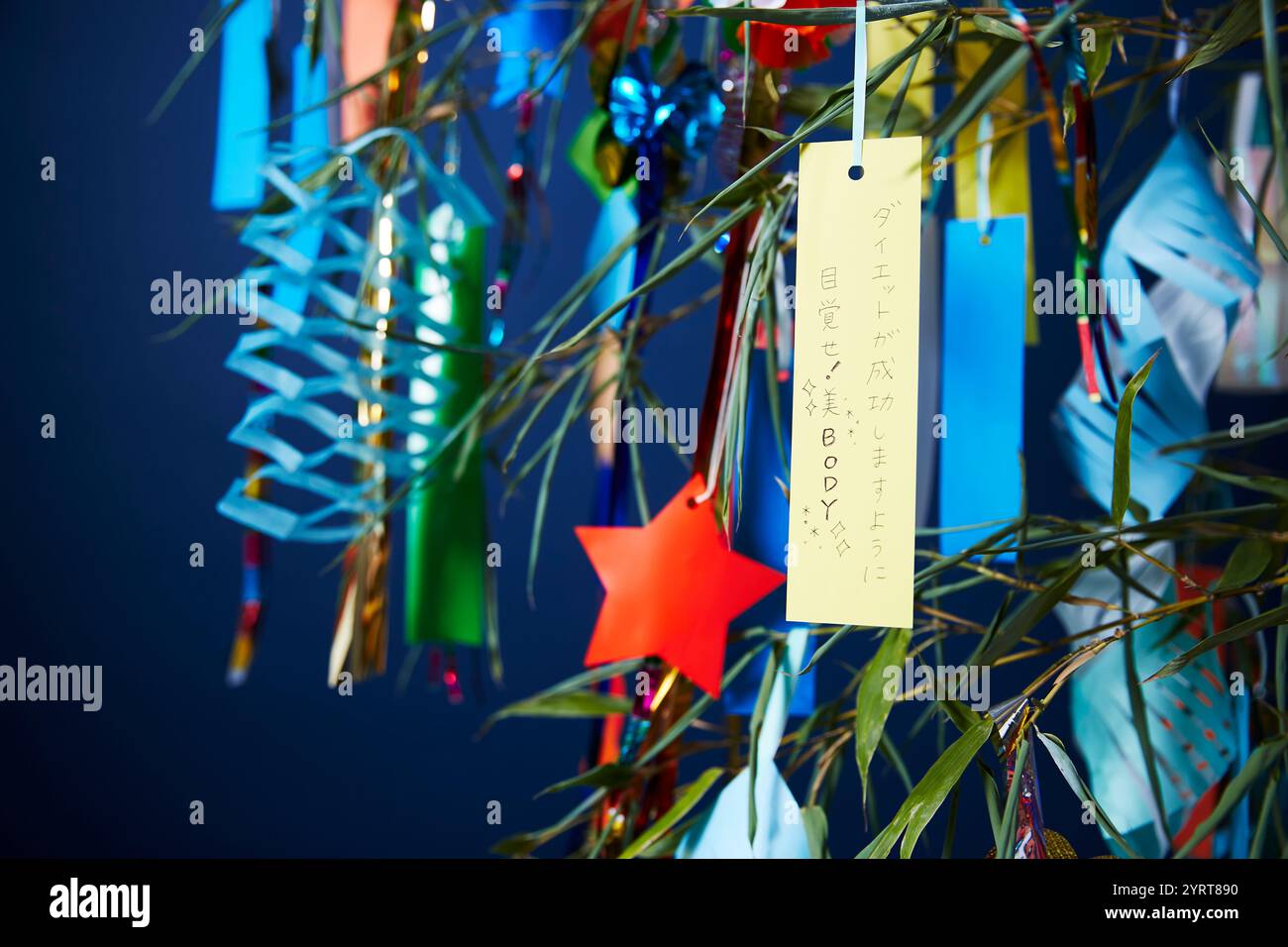 Tanabata decorations and strips of paper with wishes written on them ...