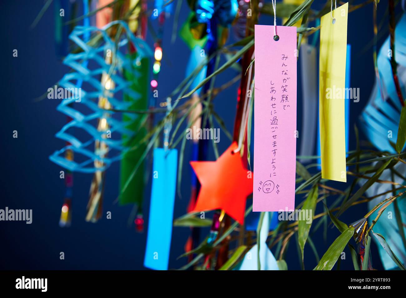 Tanabata decorations and strips of paper with wishes written on them ...
