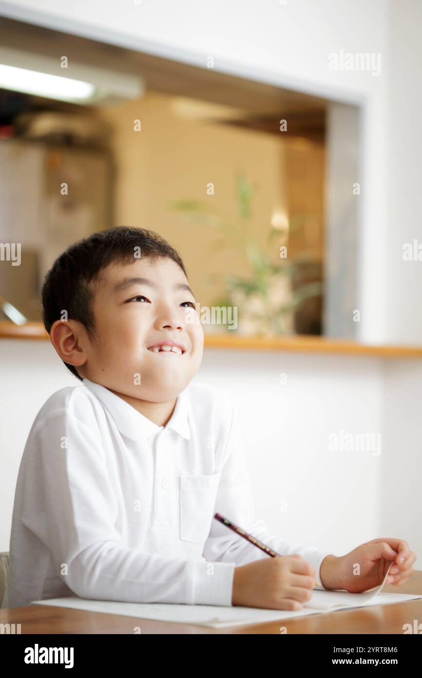 A boy studying Stock Photo - Alamy