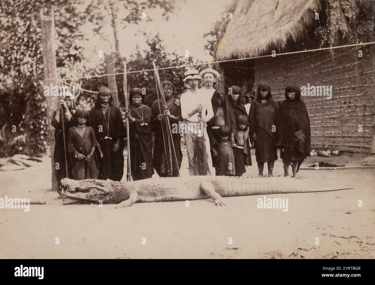 Charles Kroehle and George Huebner pose with a group of Piro natives ...