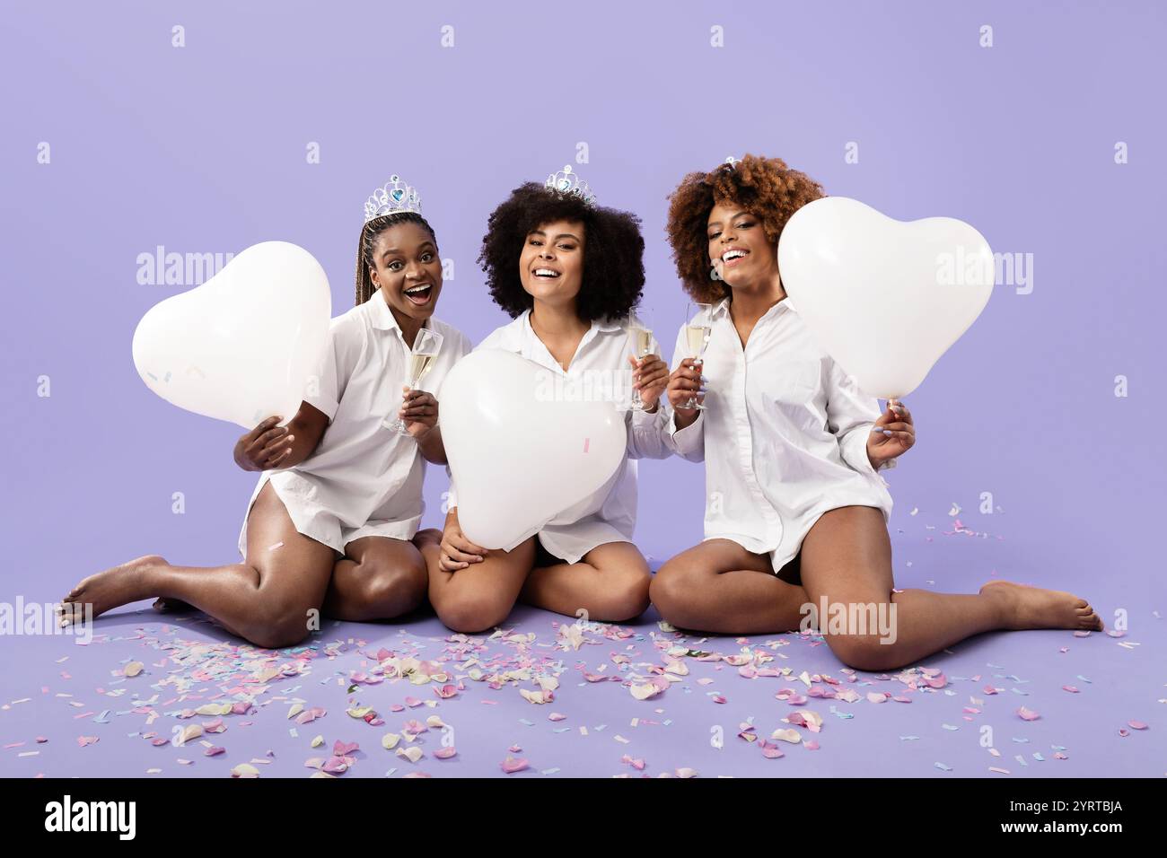 Celebrating friendship with laughter and balloons among three young ...