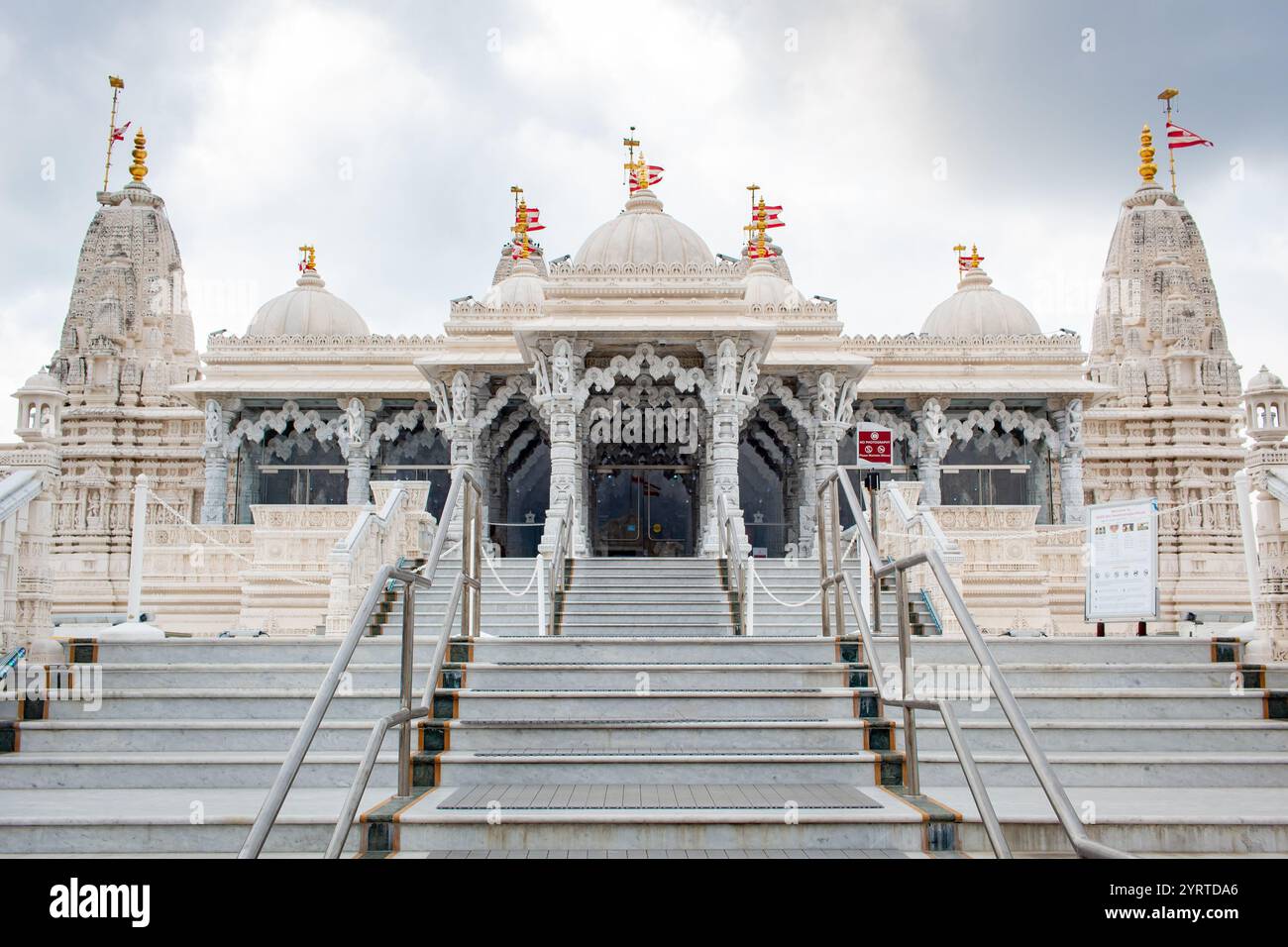 Elaborate white BAPS Shri Swaminarayan Mandir temple entrance steps ...