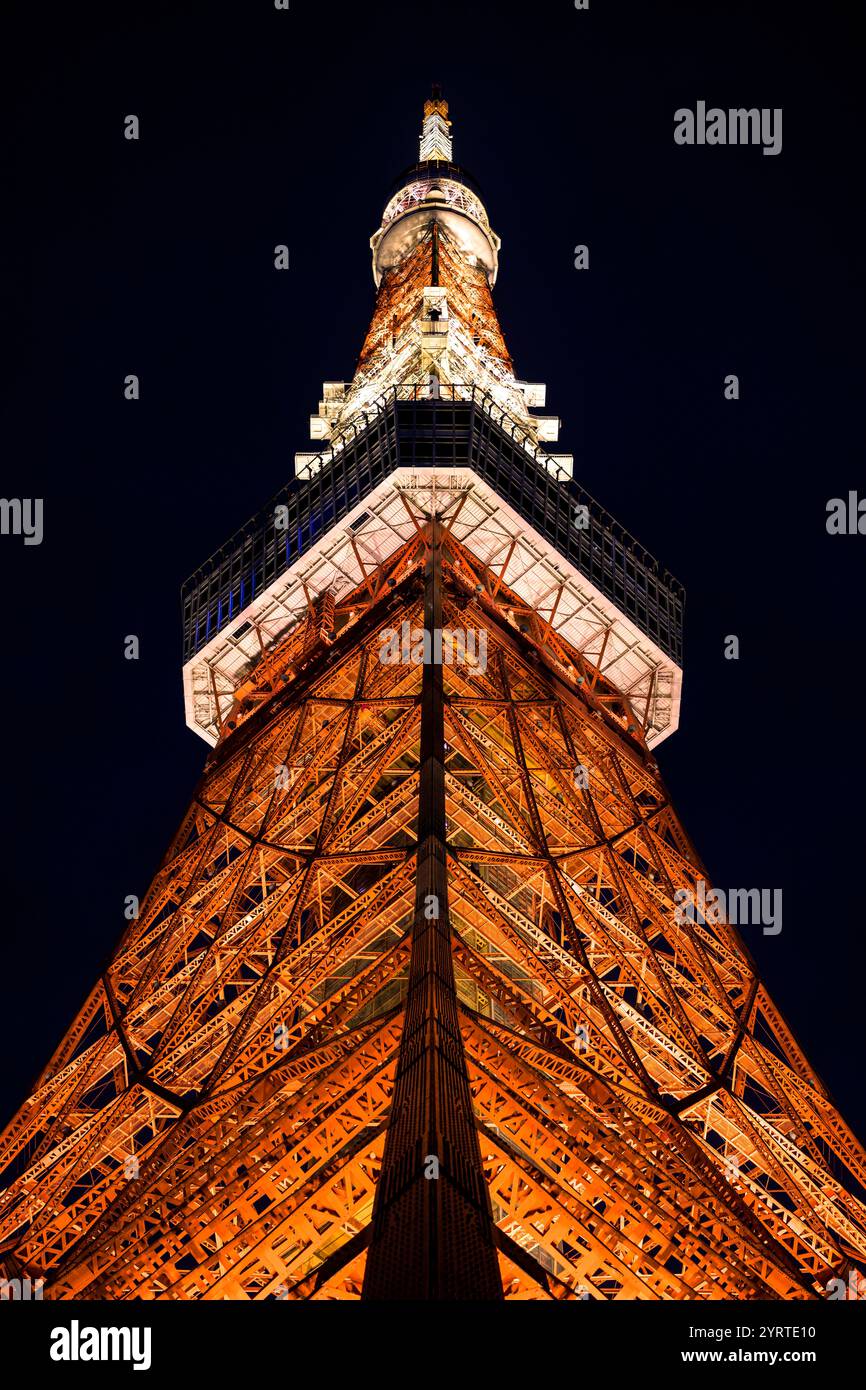 The striking steel lattice of Tokyo Tower lit up at night Stock Photo ...