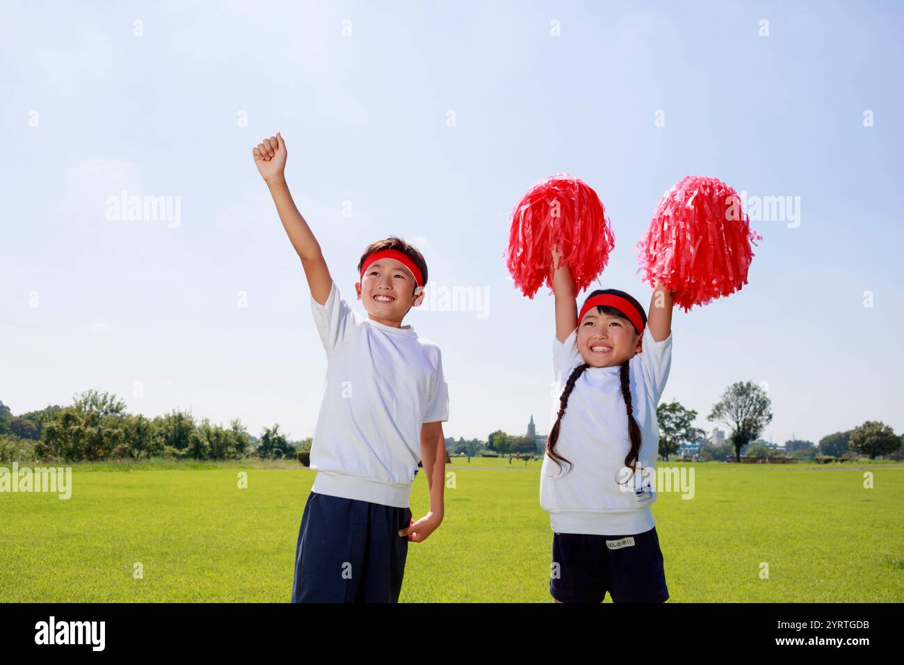 Children cheering in gym clothes Stock Photo - Alamy