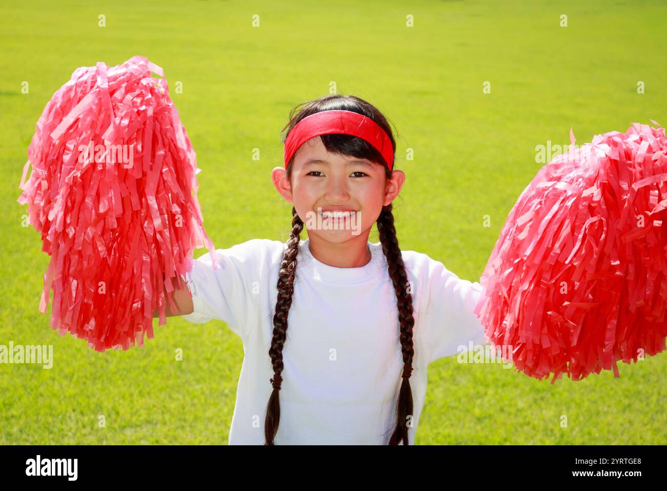 A girl cheering on the grass Stock Photo - Alamy