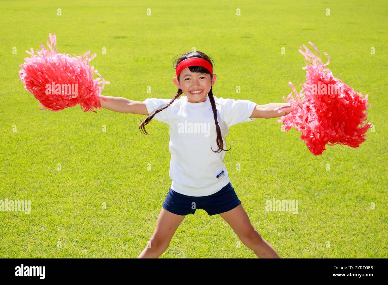 A girl cheering on the grass Stock Photo - Alamy
