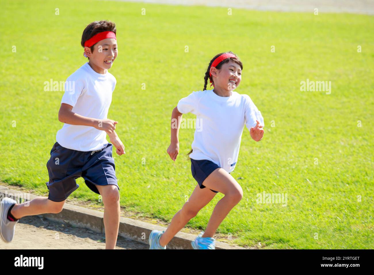 Children running in gym clothes Stock Photo - Alamy
