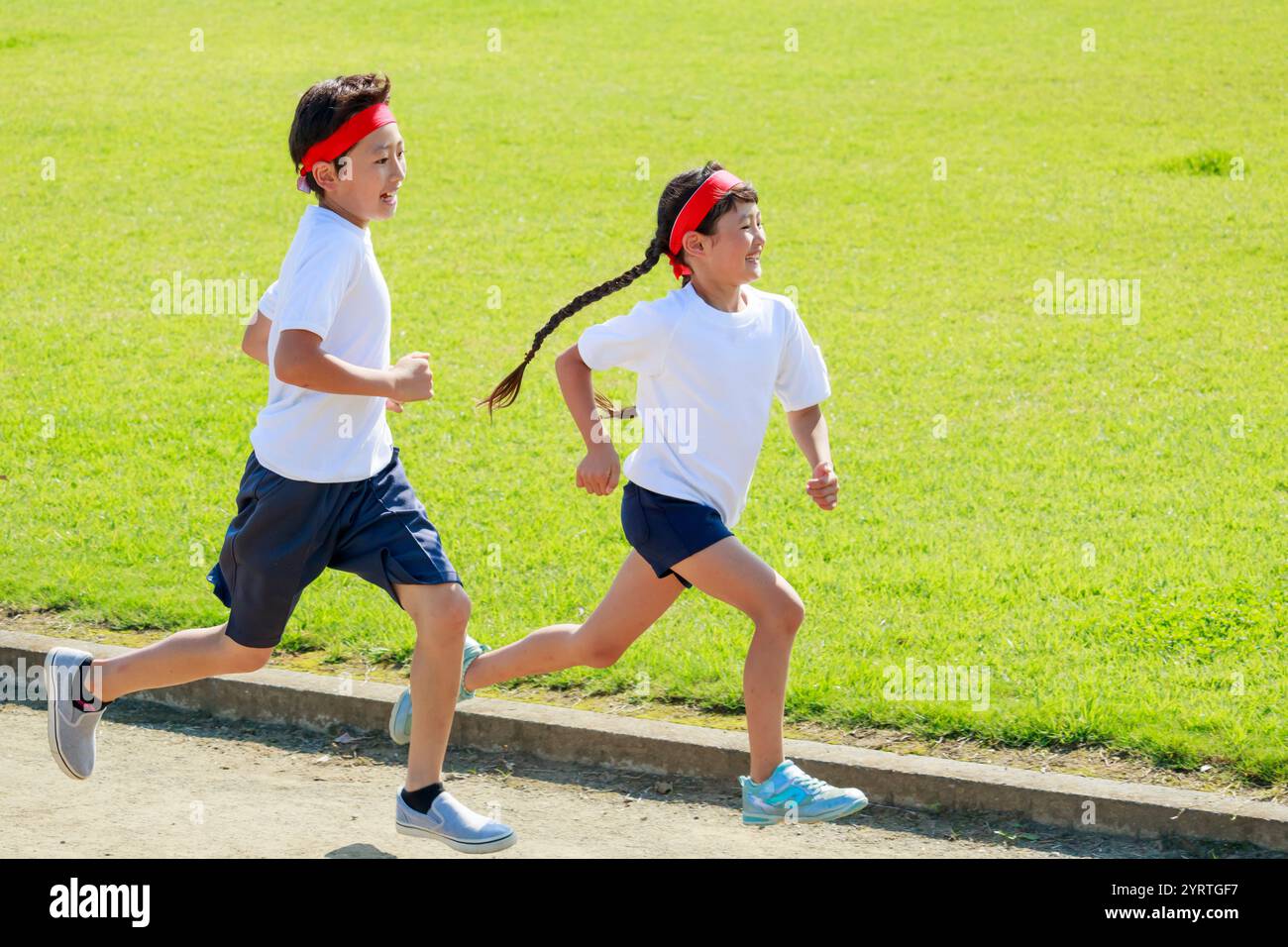 Children running in gym clothes Stock Photo - Alamy