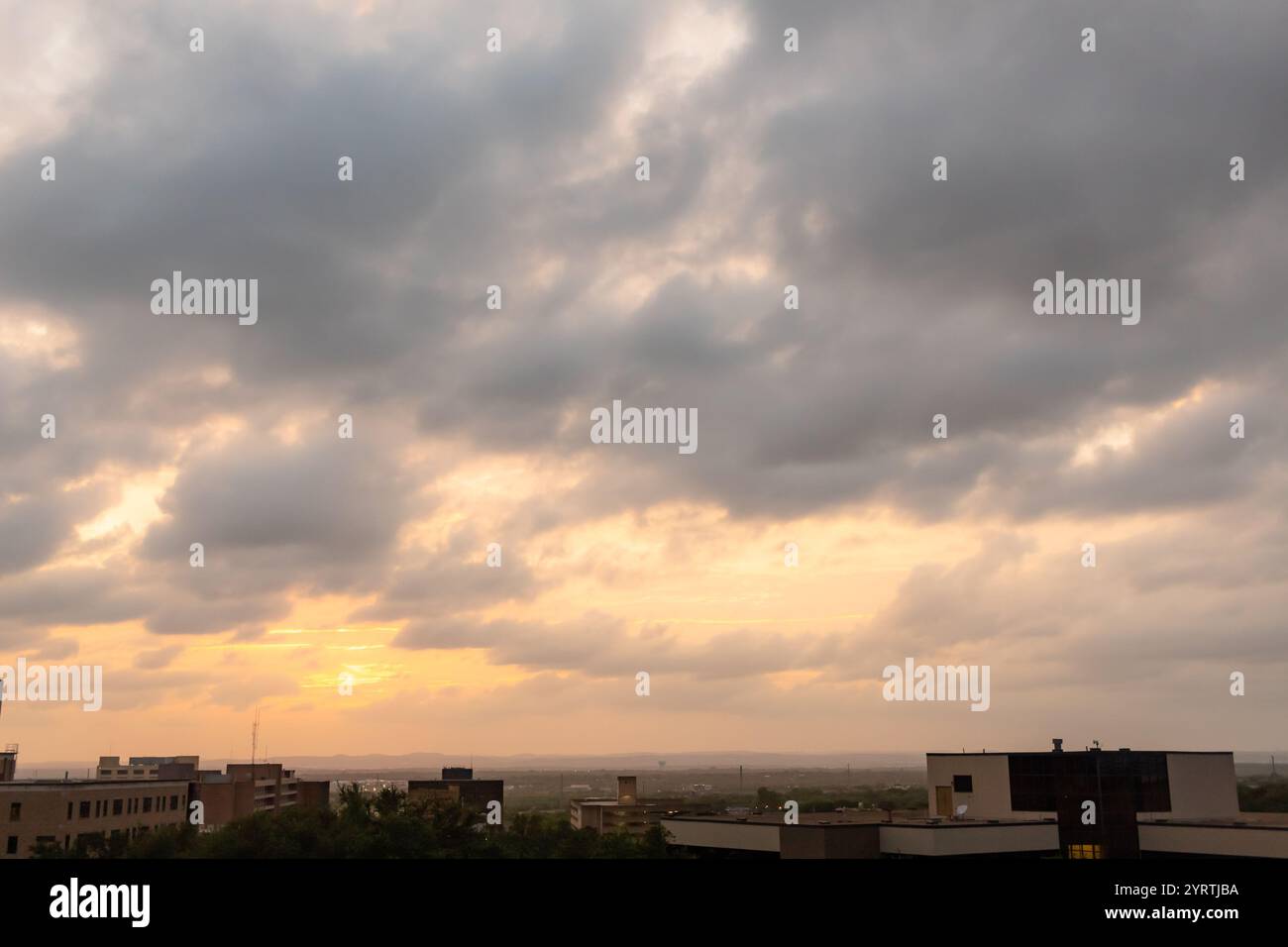 Orange dramatic and colorful sky over a horizon. Photo was taken of the ...