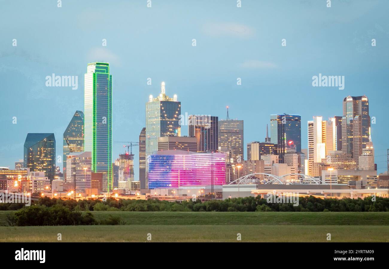Colorful downtown Dallas Texas city skyline on a cloudy blue evening ...