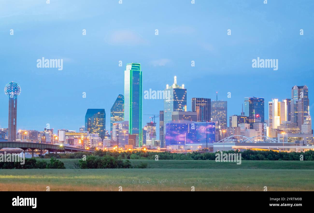 Colorful downtown Dallas Texas city skyline on a cloudy blue evening ...