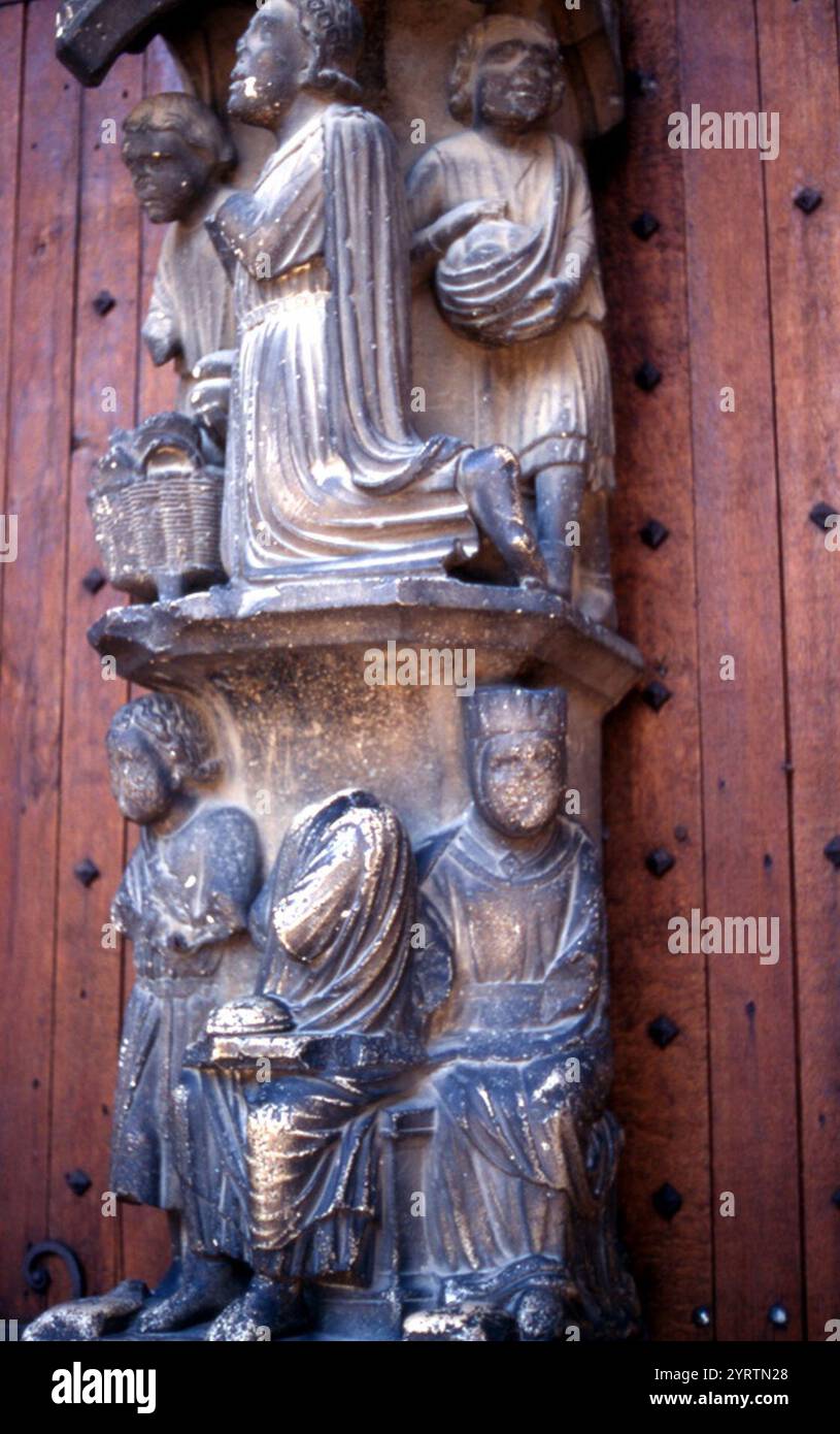 Chartres Cathedral; bakers or bread donors; figures below trumeau ...