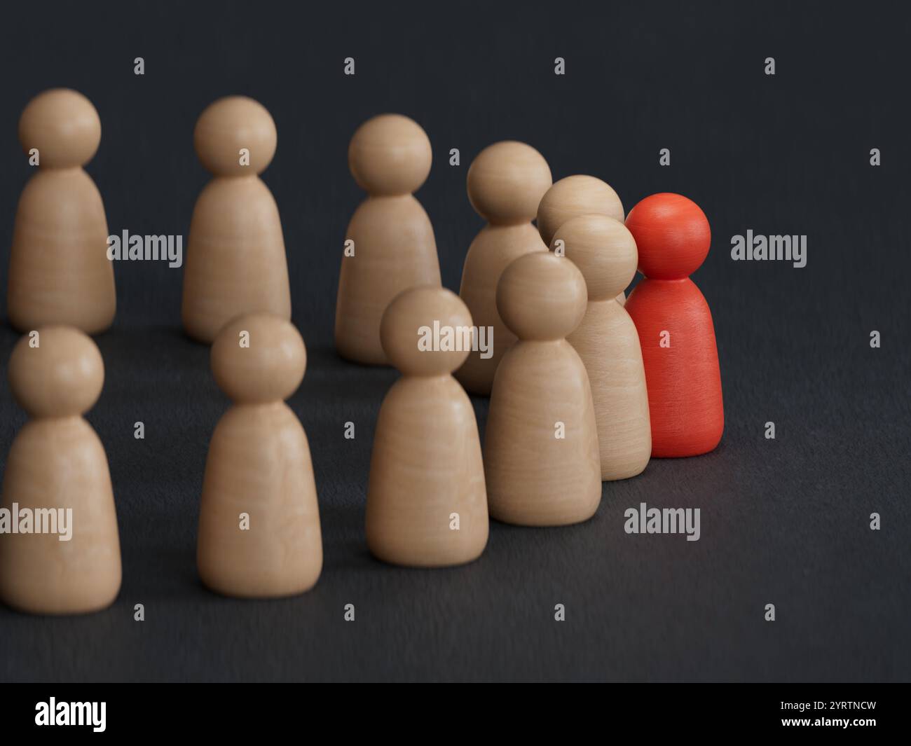 A 3d concept graphic depicting a red person standing out from the crowd ...