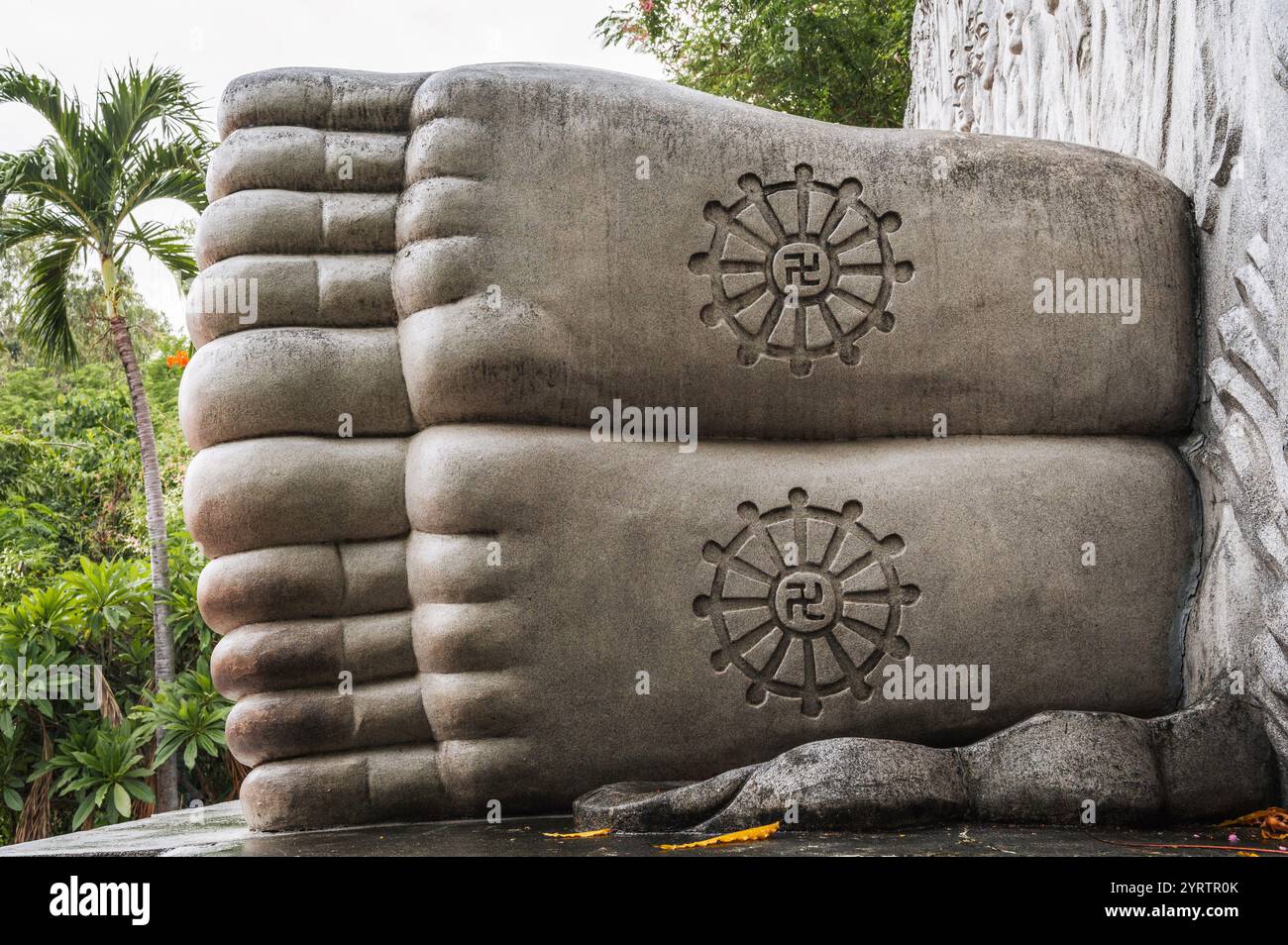 heels of big Buddhist statue of lying Buddha at the Long Son Pagoda in ...