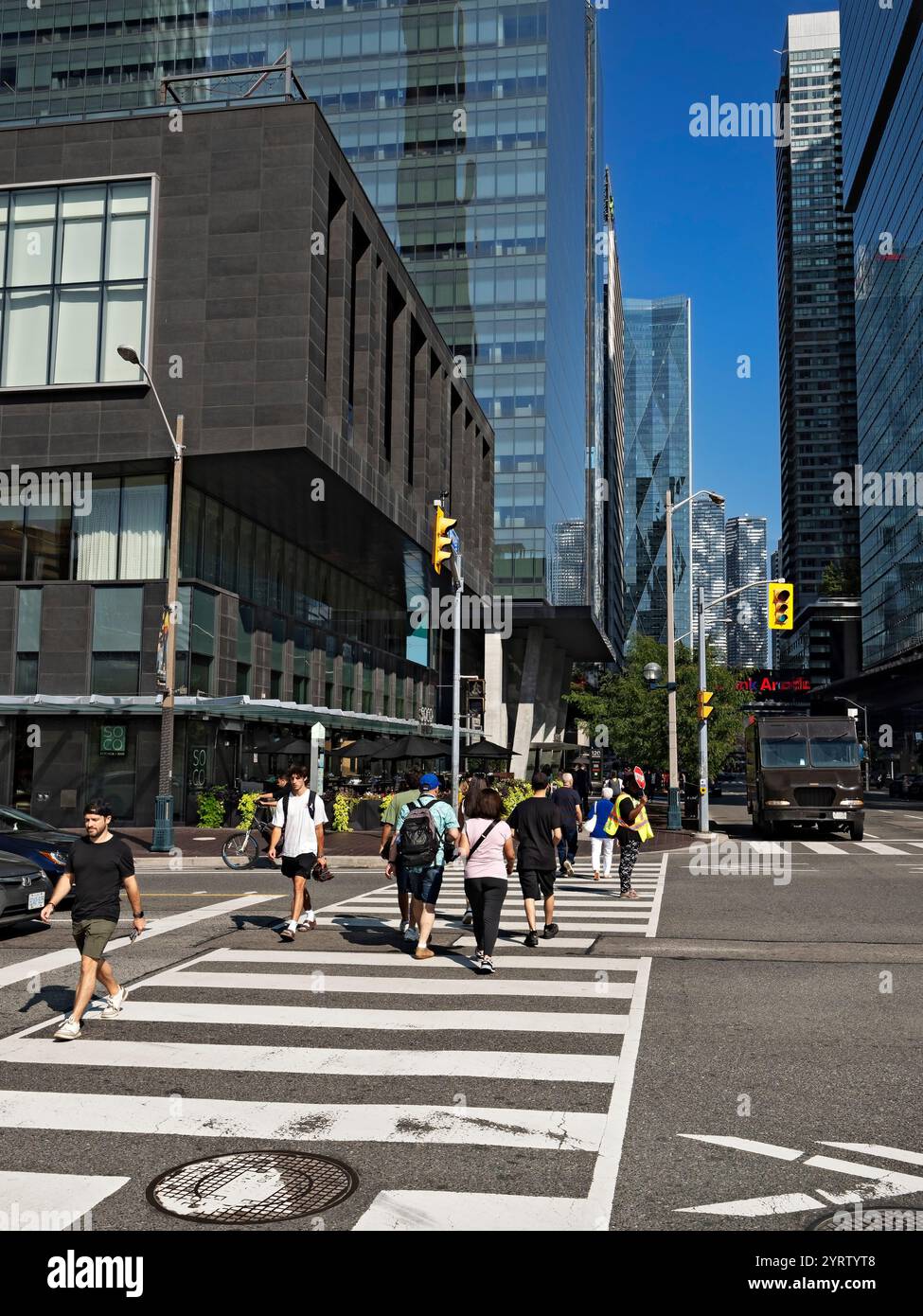 Toronto Canada / Pedestrians walk accross the intersection of Bremner ...