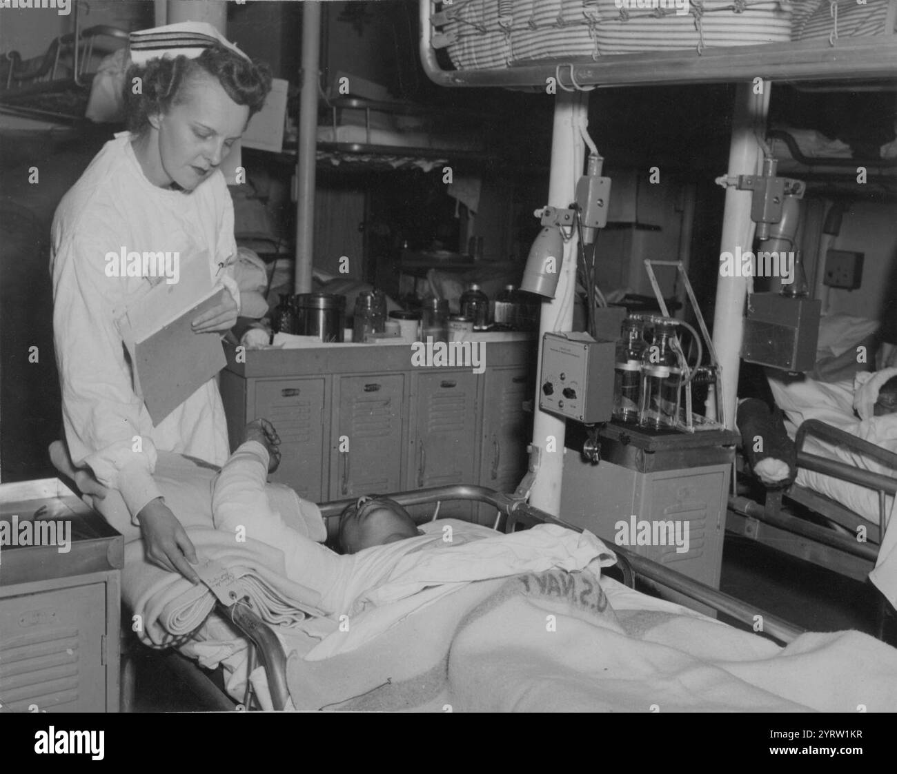Chinese blast victim being cared for aboard USS Repose AH-16 after an ...