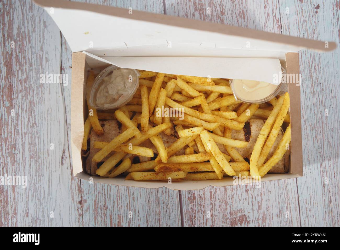 Crispy French Fries with various Dipping Sauces in a Takeout Box Stock ...