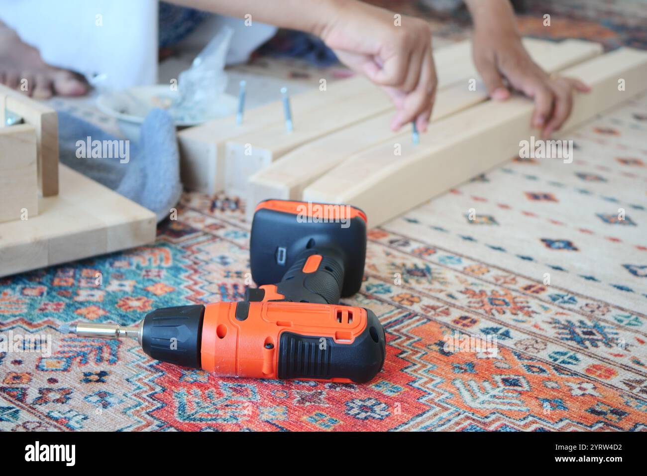Engaging in a DIY home project using various power tools and wooden ...
