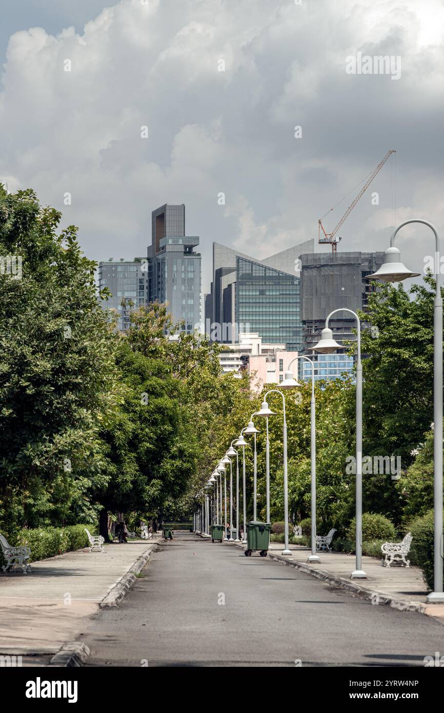 Bangkok, Thailand - 17 Oct, 2024 - A park path with a concrete border ...