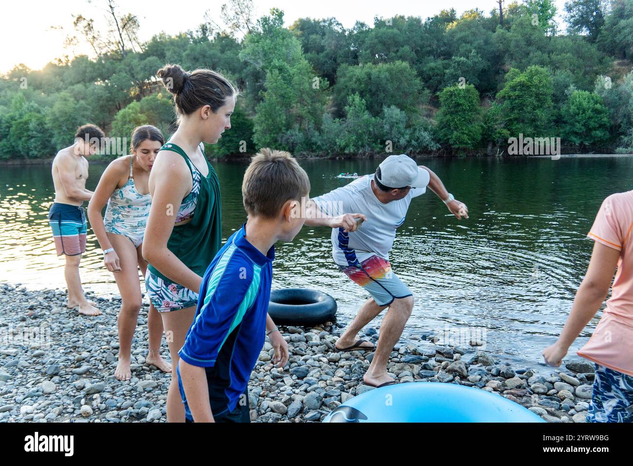Children throwing stones hi-res stock photography and images - Alamy