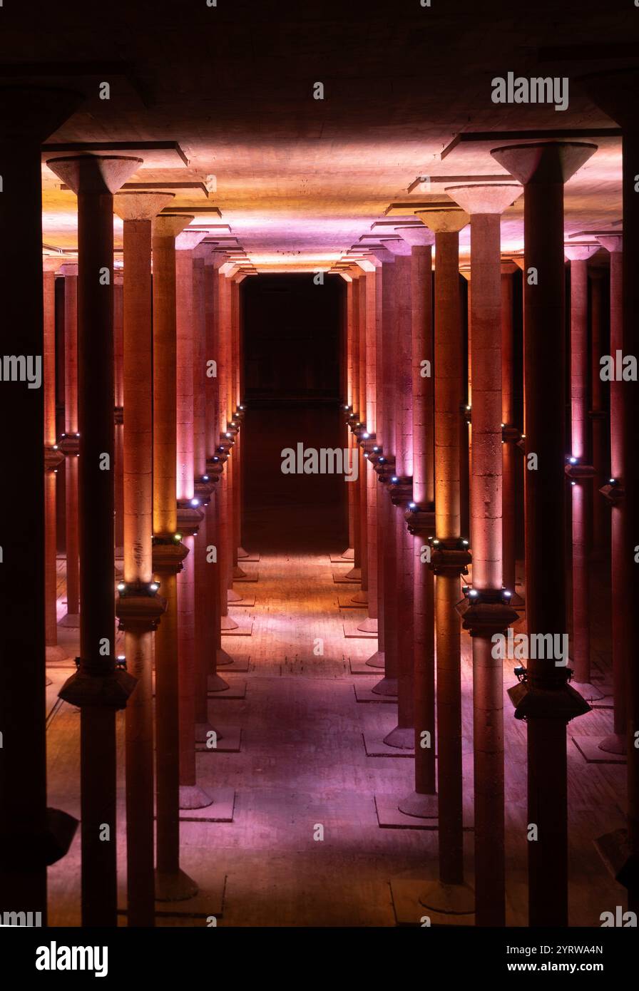 Buffalo Bayou Park Cistern lit with pink, gold, and purple lights for ...