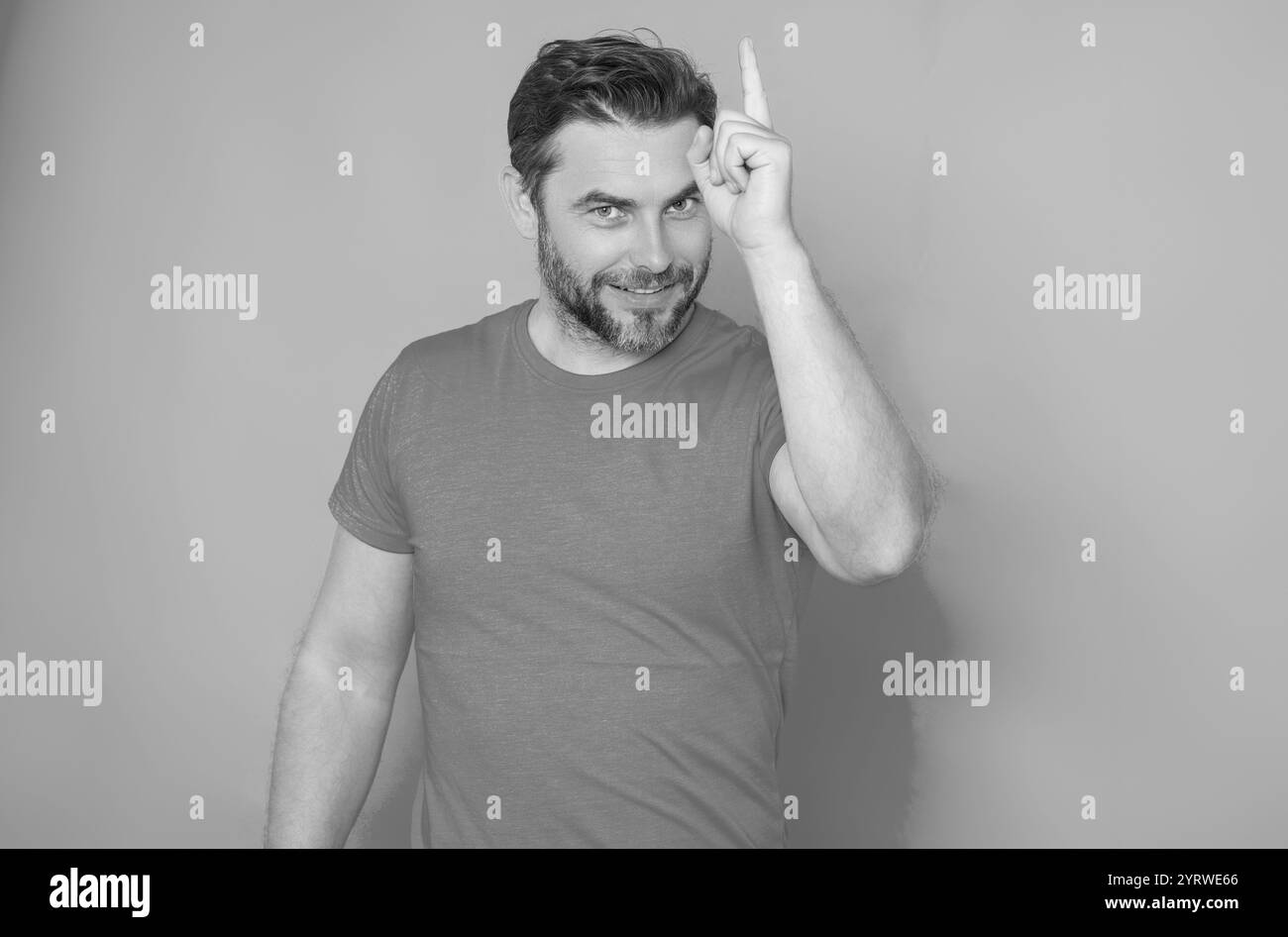 Thoughtful man point up thinking of idea, pointing up. Portrait of man ...