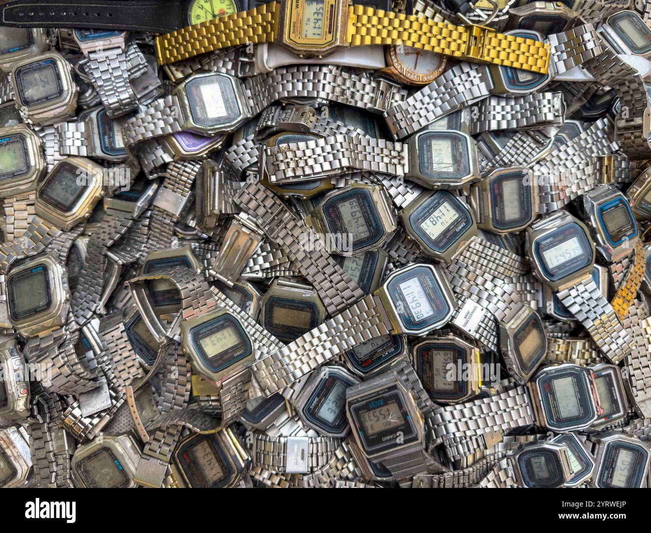 Pile of casio digital used watches with metal bands Stock Photo - Alamy