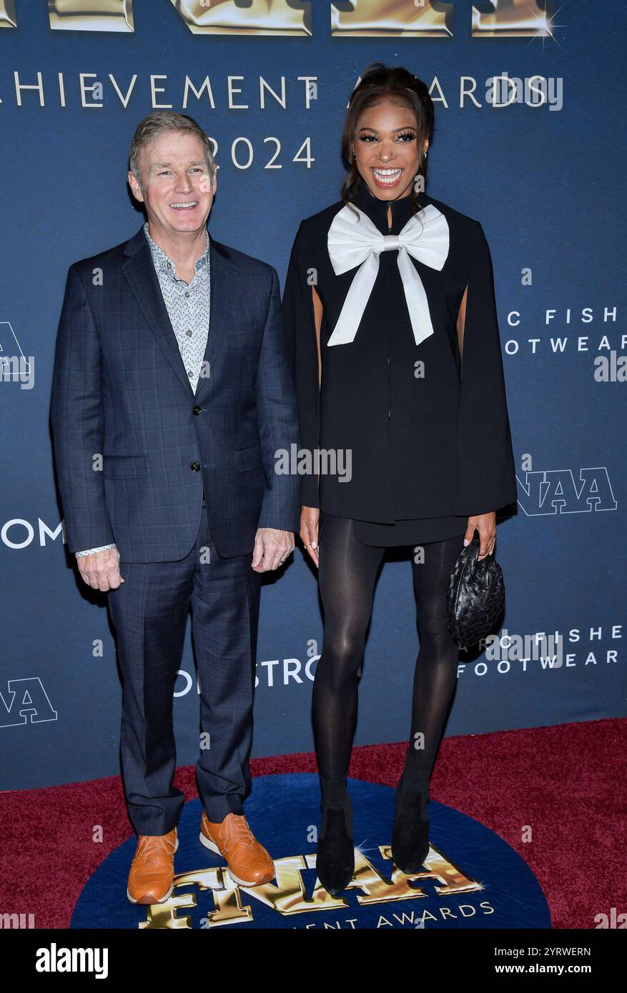 New Balance CEO Joe Preston, left, and Gabby Thomas attend the 38th ...