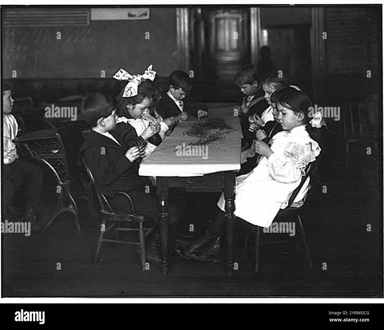 Classroom showing school children at a table including Ruth Warner ...