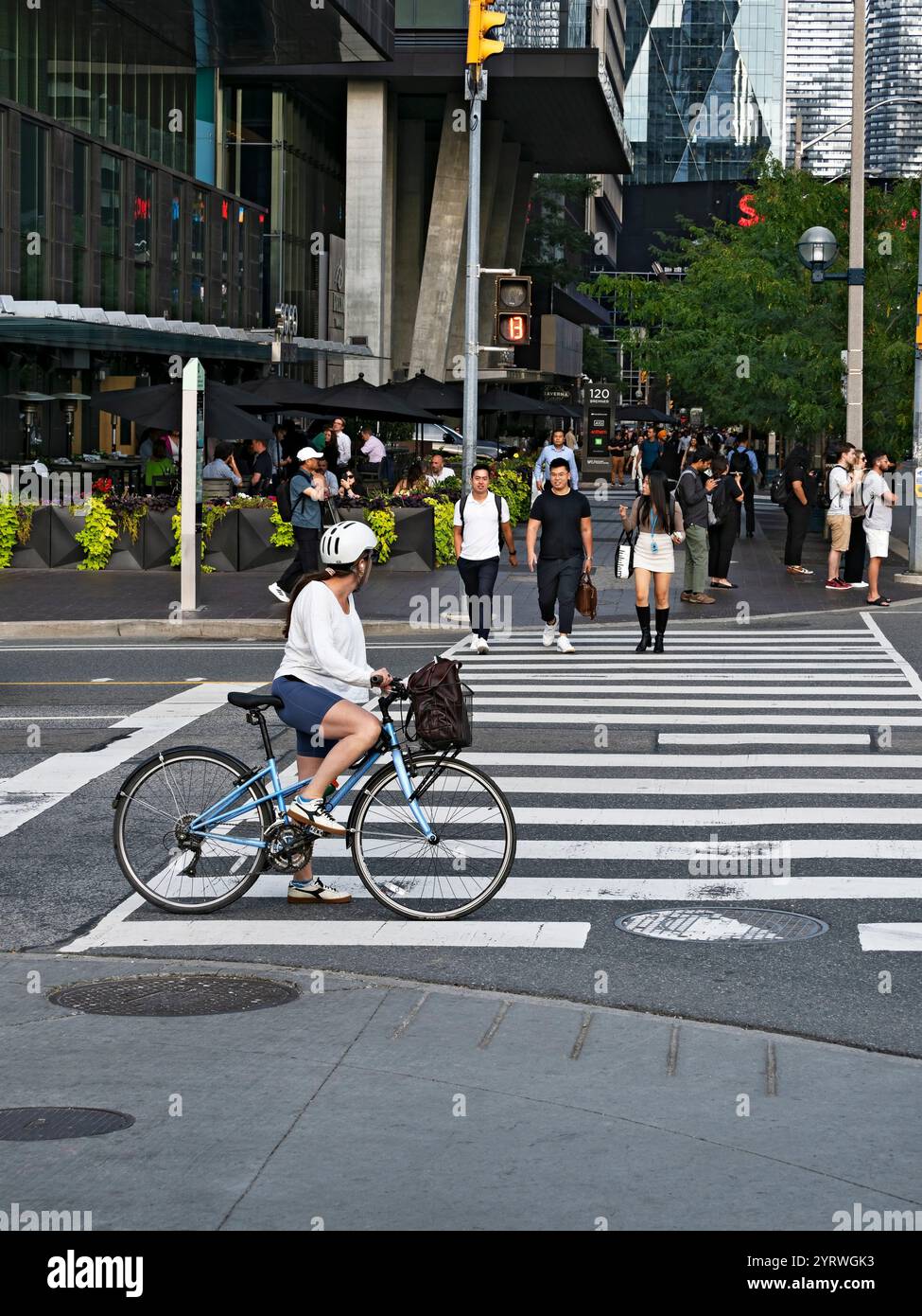 Toronto Canada / Pedestrians walk across the intersection of Bremner ...