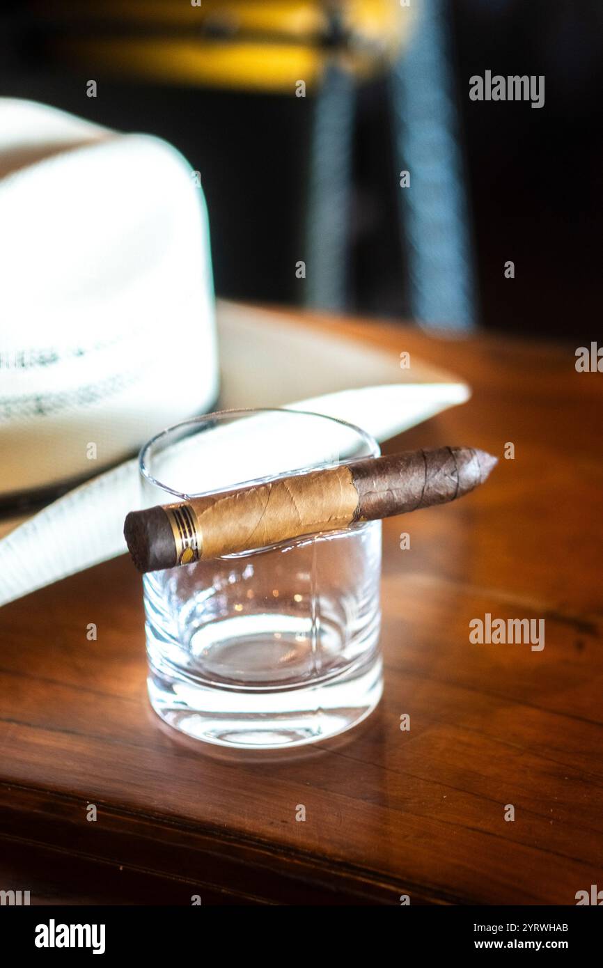 Relaxing moment with a cigar and whiskey in a cozy setting Stock Photo ...